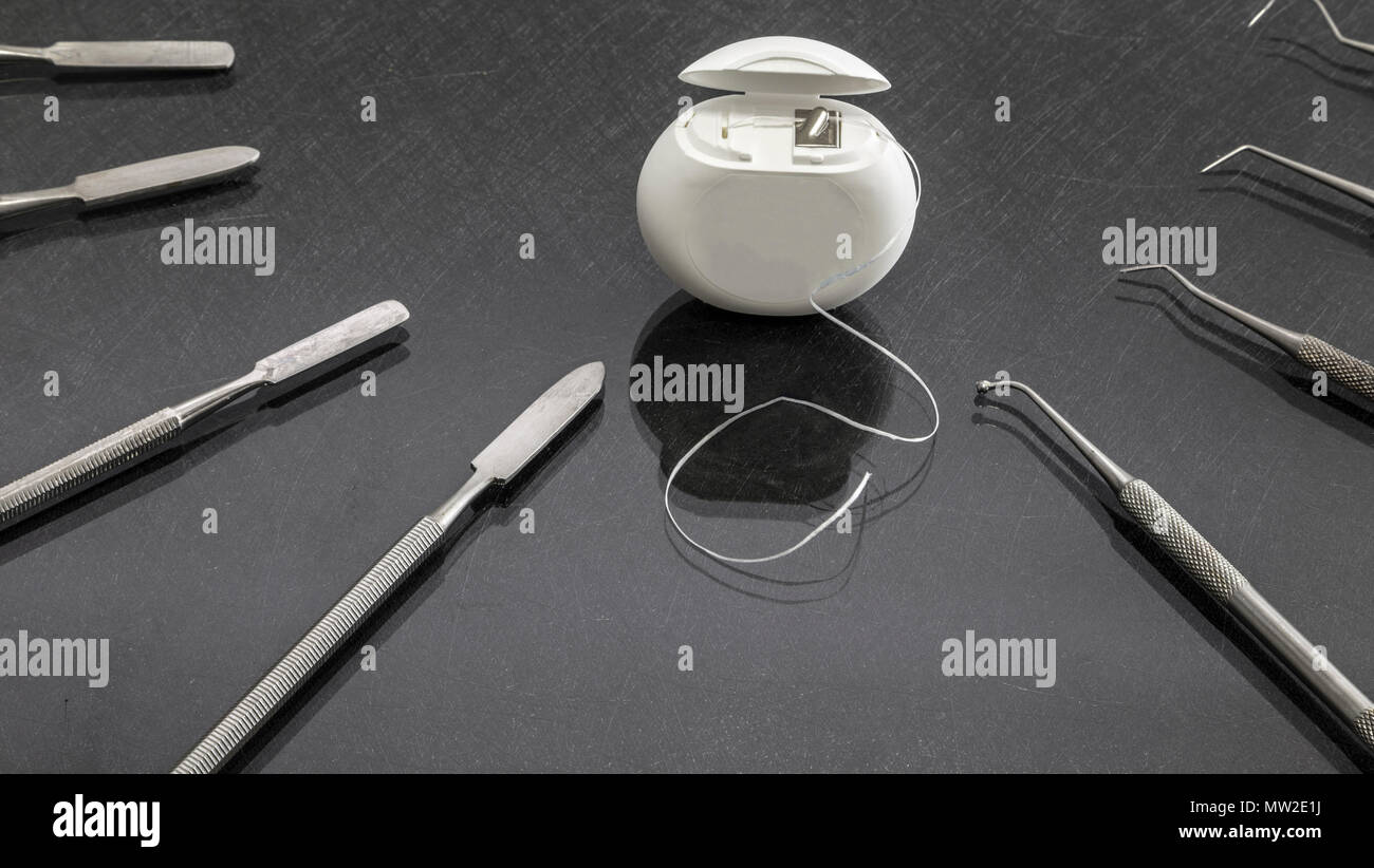 Dental instruments and floss for dental treatment Stock Photo - Alamy