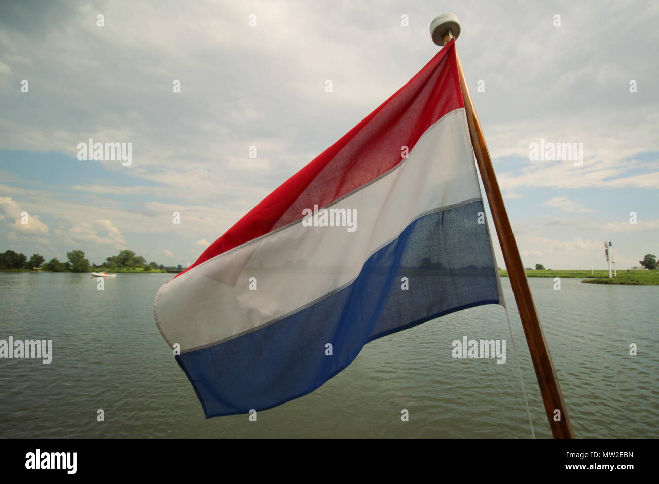 Dutch flag waving on a boat sailing on a river Stock Photo - Alamy
