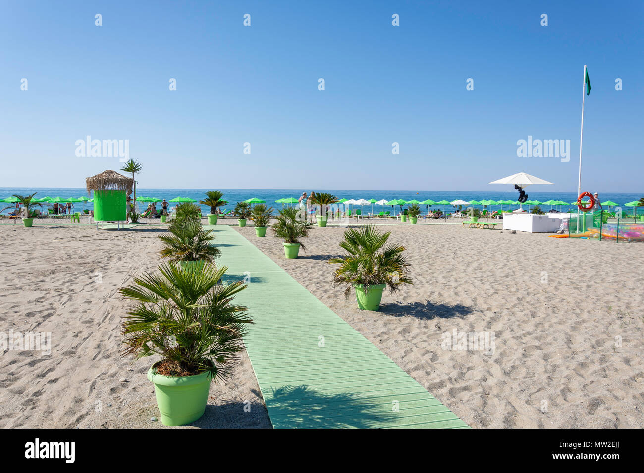 Beach green sunbeds parasols walkway edem beach adelianos kampos hi-res ...