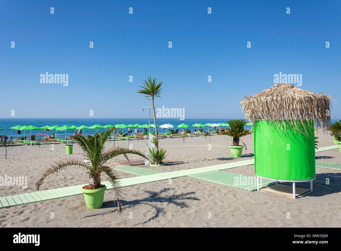 Beach green sunbeds parasols walkway edem beach adelianos kampos hi-res ...