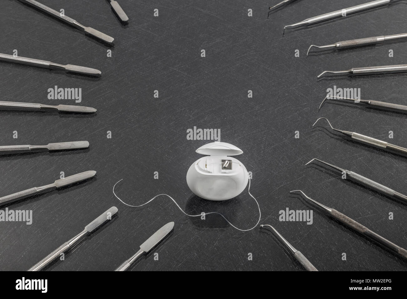Different instruments with white dental floss.Top view Stock Photo - Alamy