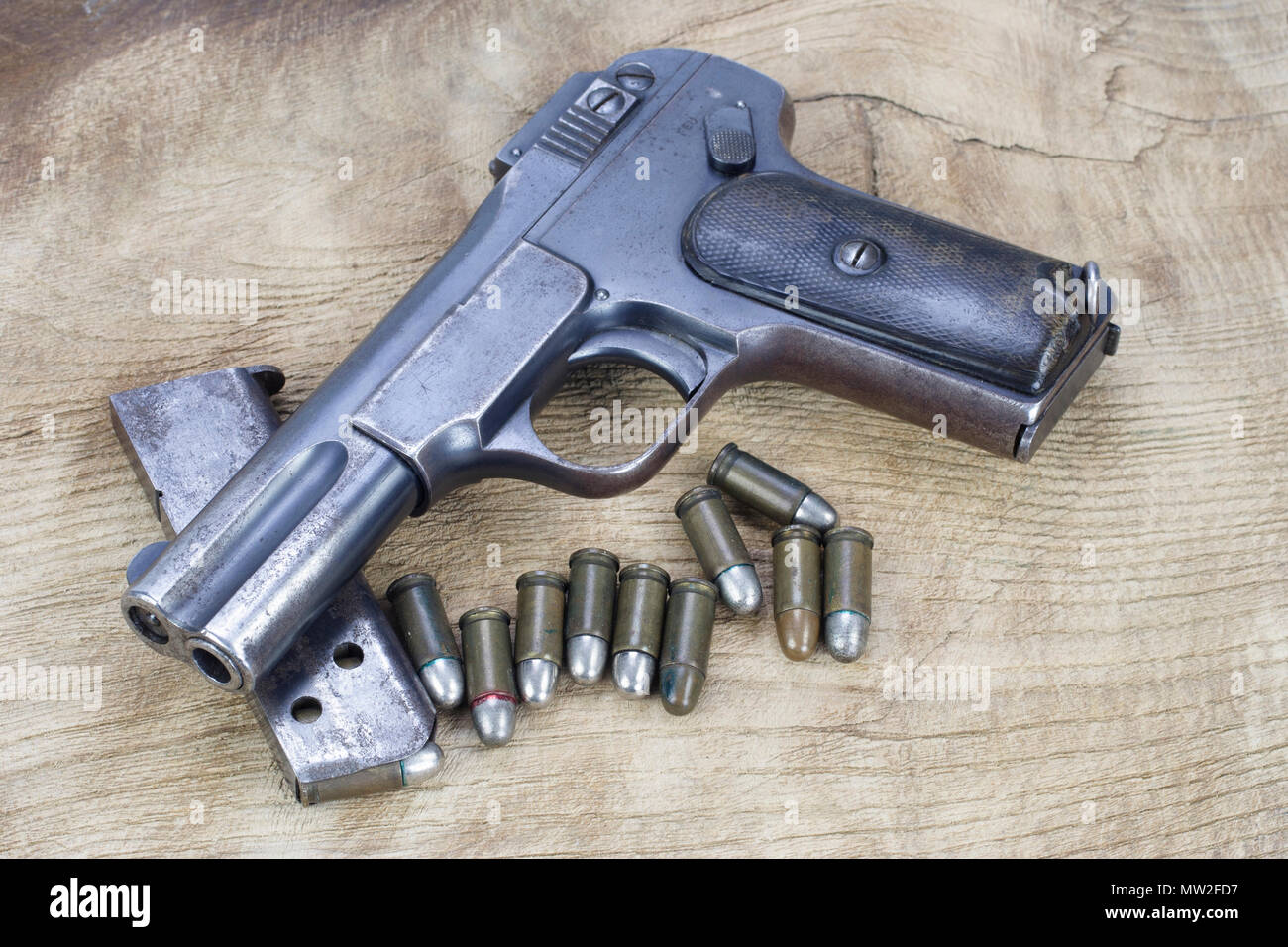 Old rusty handgun on wooden background Stock Photo - Alamy