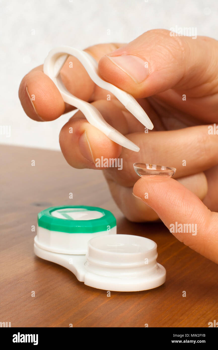 Lenses On Finger High Resolution Stock Photography and Images - Alamy