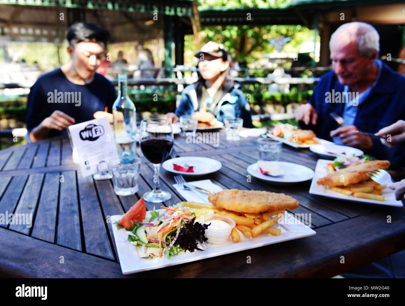 Tourist enjoying their lunch and local wine at the restaurant at the ...