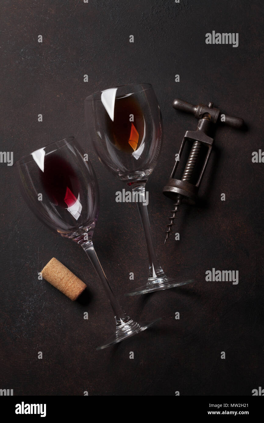 Wine glasses and vintage corkscrew. Top view Stock Photo - Alamy