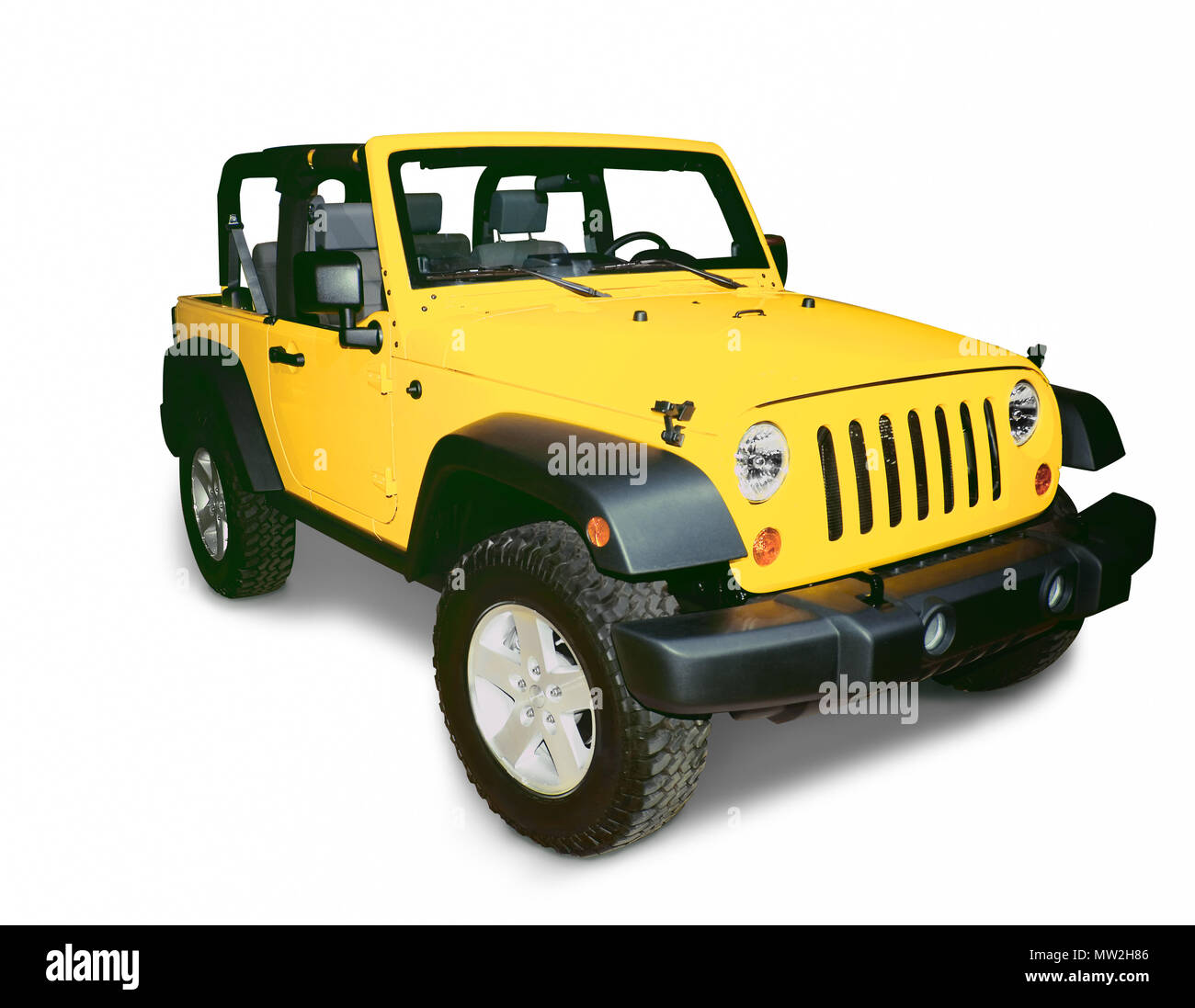 A bright yellow 4-wheel drive off road utility vehicle isolated on a ...