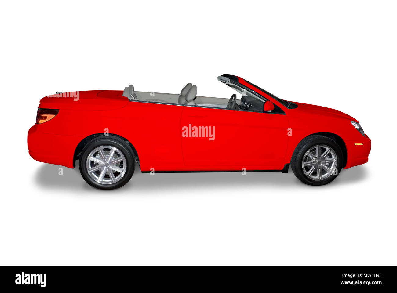 Beautiful new red convertible car isolated on a white background. A ...