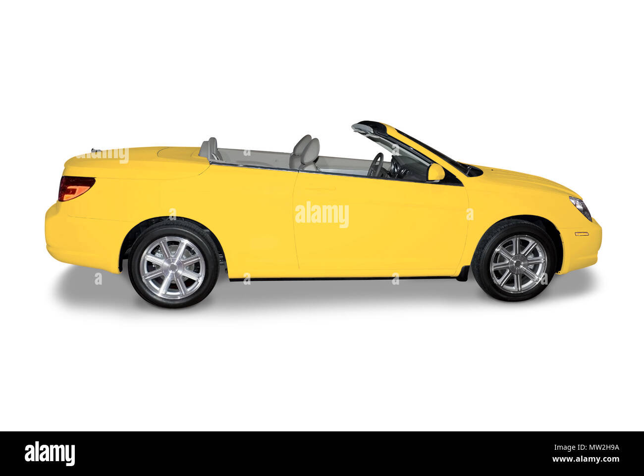 Beautiful new yellow convertible car isolated on a white background. A ...