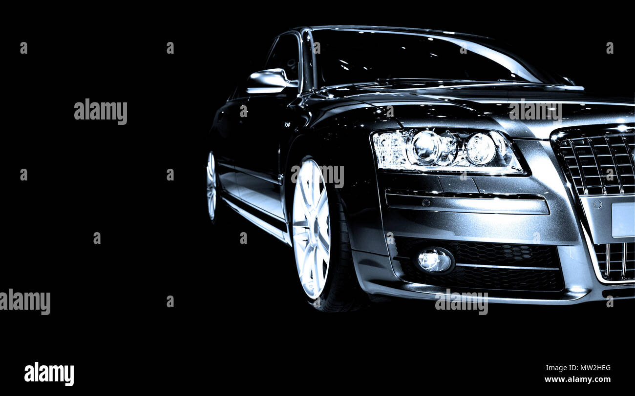 An abstract filtered car with a slight blue tone. Very metalic looking ...