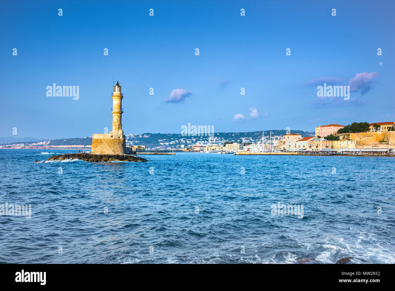 The beautiful old harbor of Chania with the amazing lighthouse, mosque ...