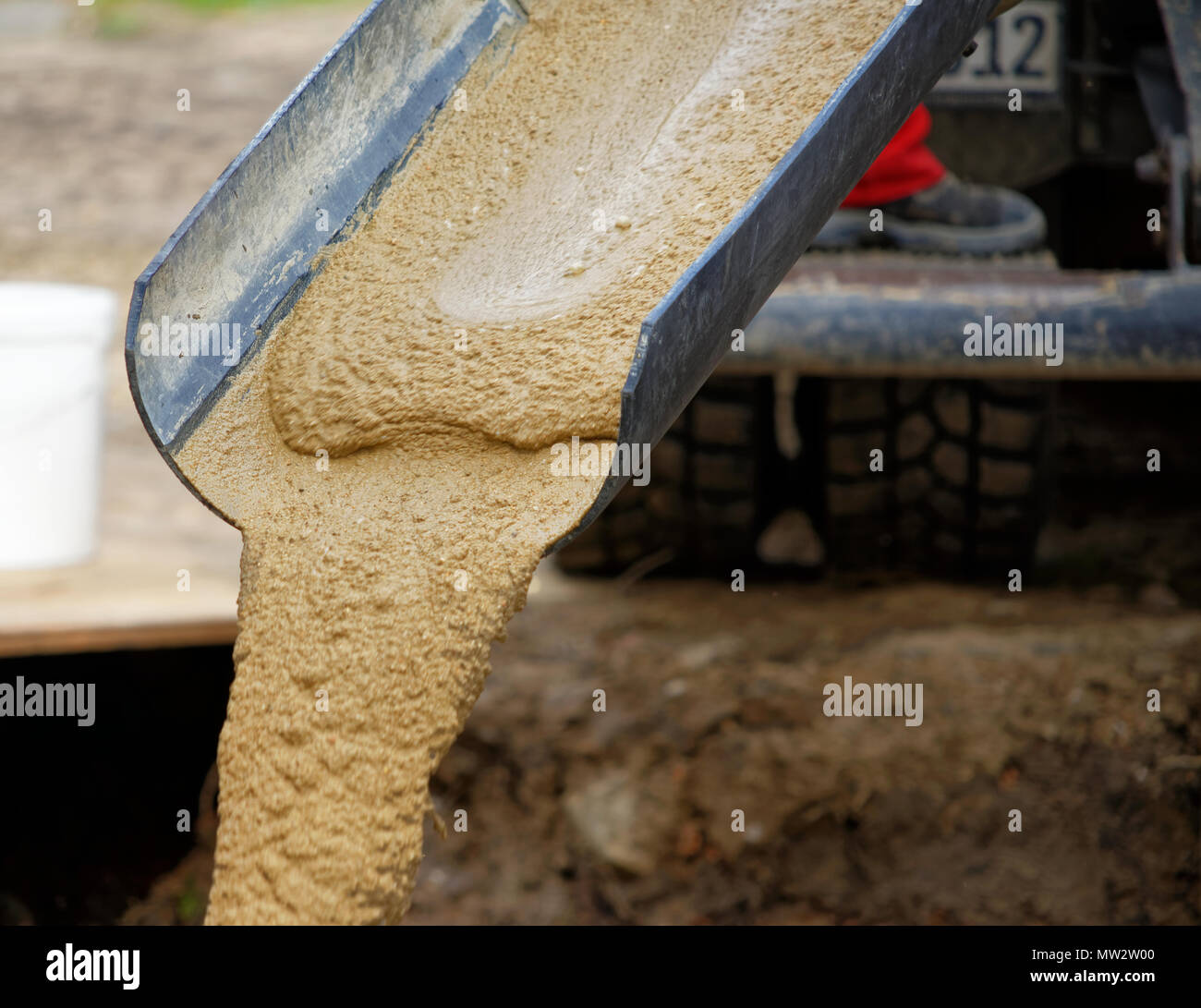 Liquid soil is poured from the ramp of concrete mixer, Germany Stock ...