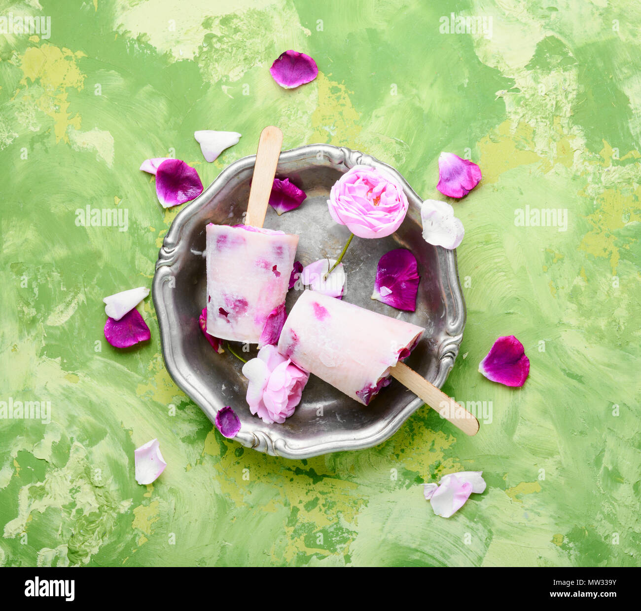 Summer vanilla ice cream with fresh rose flowers Stock Photo - Alamy
