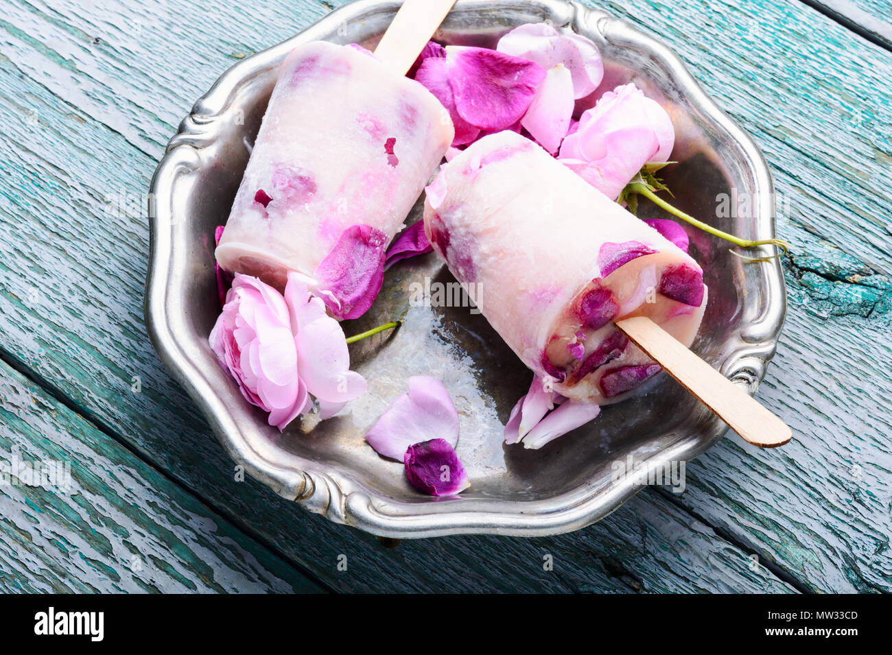 Summer vanilla ice cream with fresh rose flowers Stock Photo - Alamy