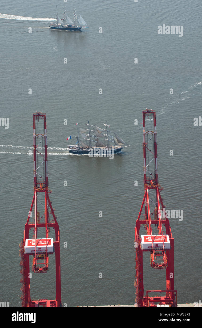 Aerial photo of tall ships passing Port of Liverpool tall red cranes ...