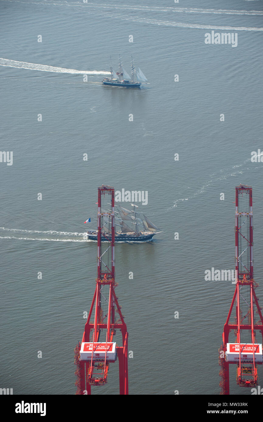Aerial photo of tall ships passing Port of Liverpool tall red cranes ...