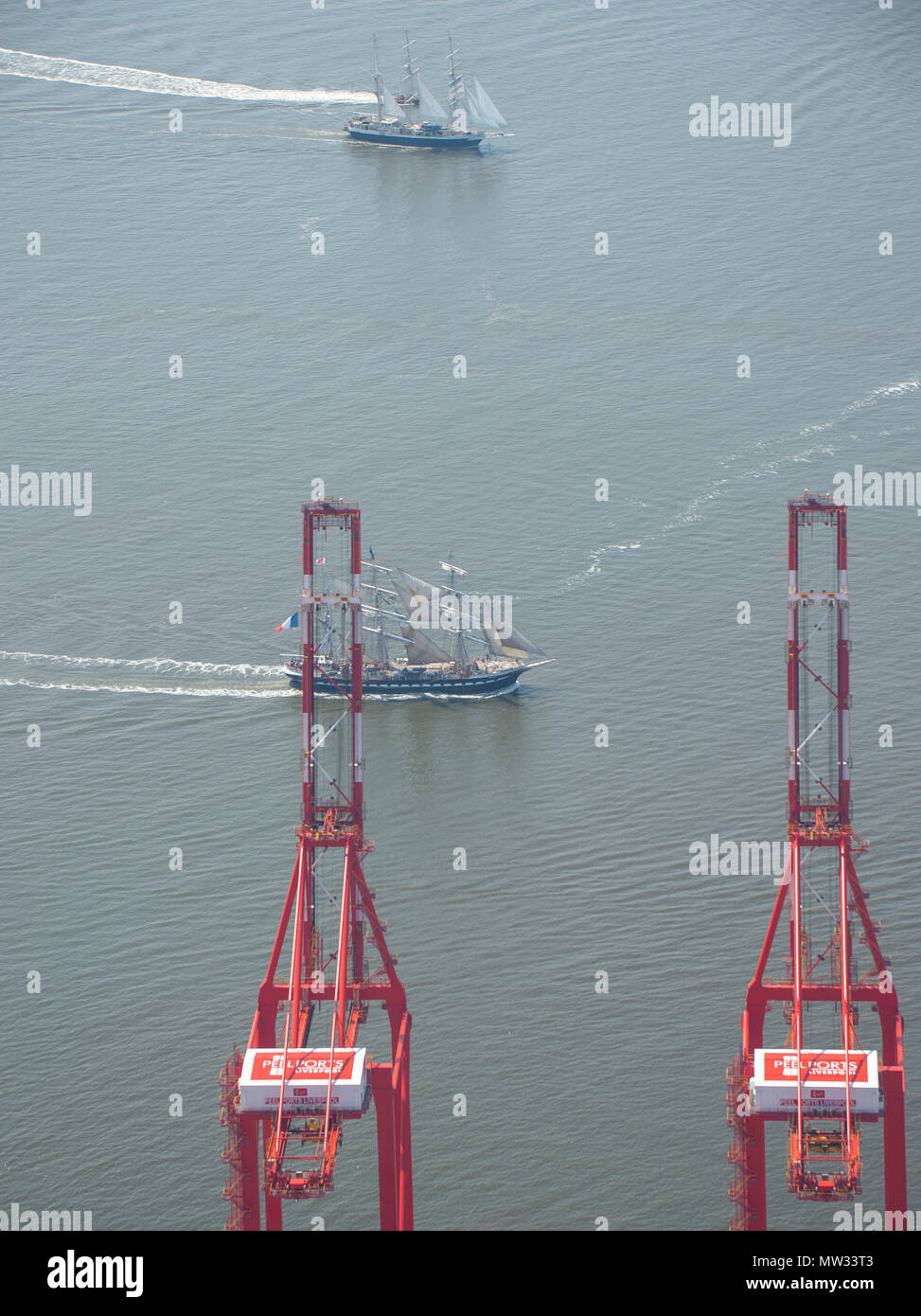 Aerial photo of tall ships passing Port of Liverpool tall red cranes ...