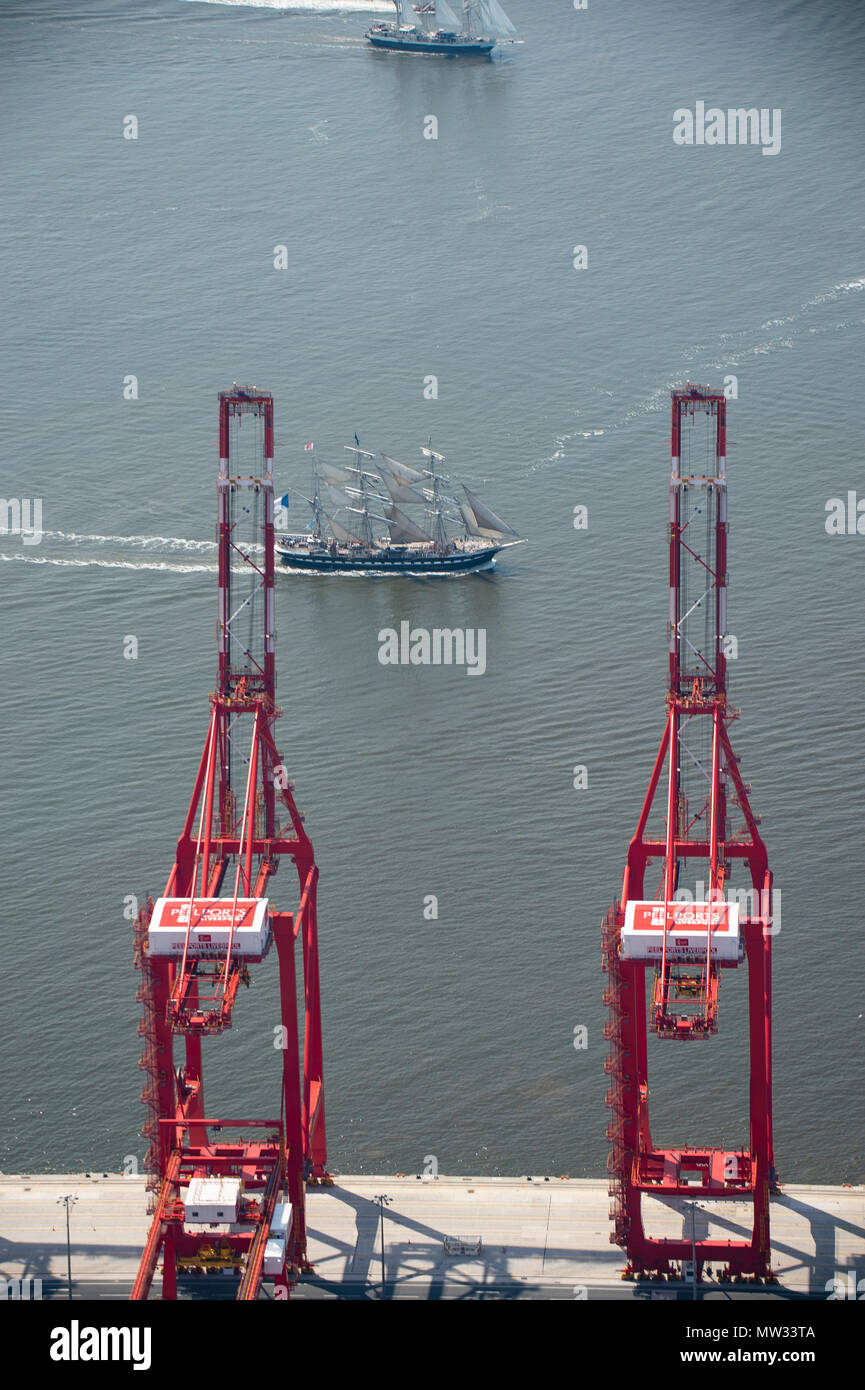 Aerial photo of tall ships passing Port of Liverpool tall red cranes ...