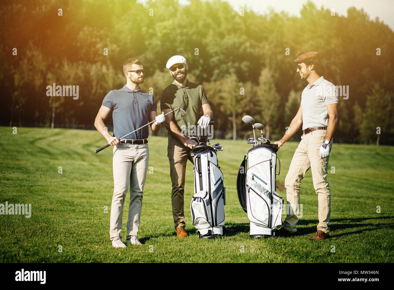 Sport golf player action club walking hi-res stock photography and ...
