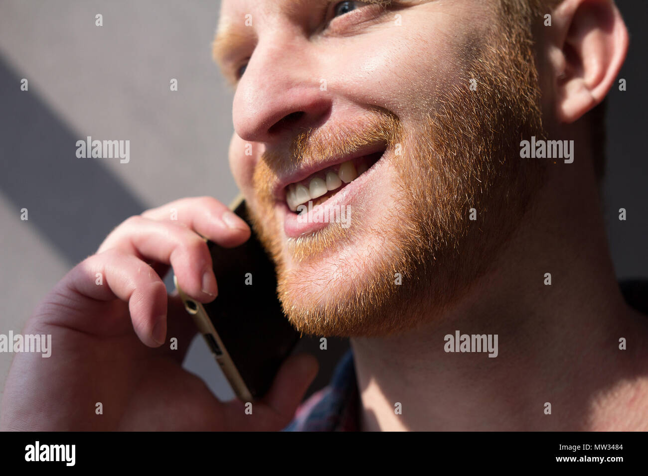 Middle aged man recieving phone call close up. Close shot of young guy ...