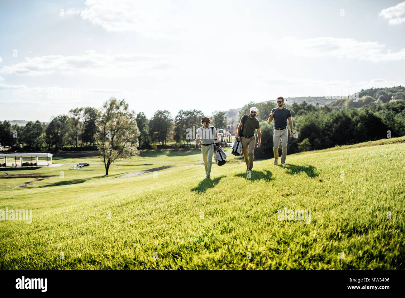 Sport golf player action club walking hi-res stock photography and ...