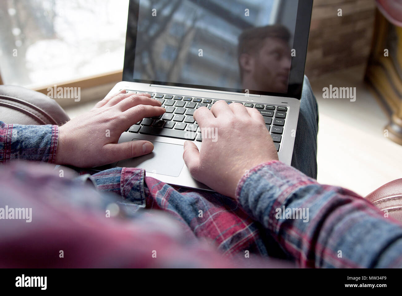 Over shoulder picture of man typing on computer keyboard. Close up shot ...