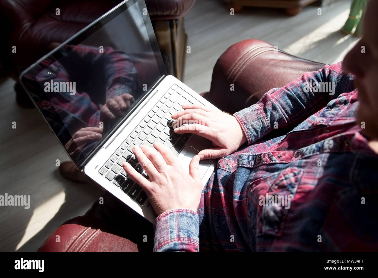Attractive man working on computer Stock Photo - Alamy