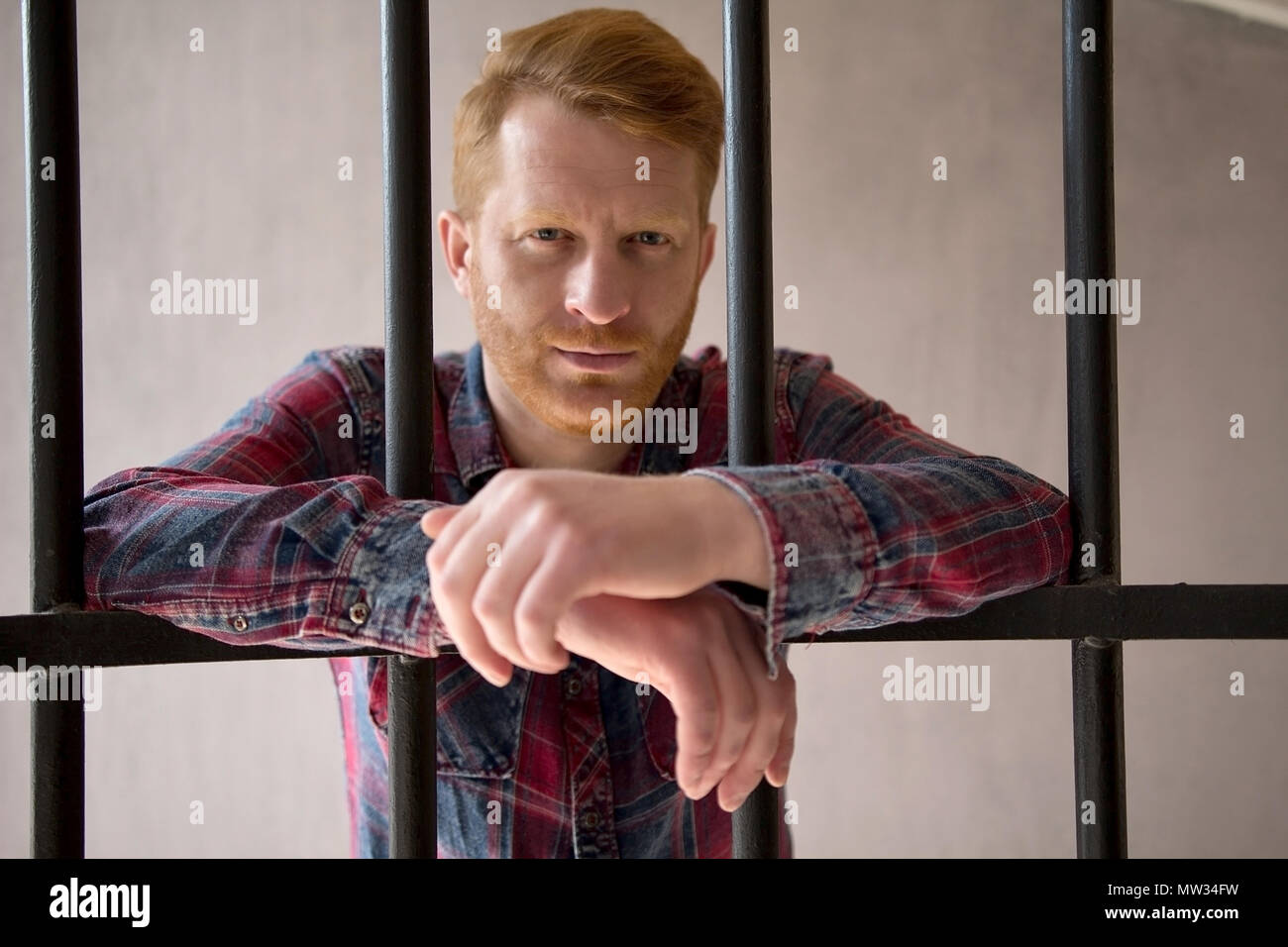 Man behind bars hi-res stock photography and images - Alamy