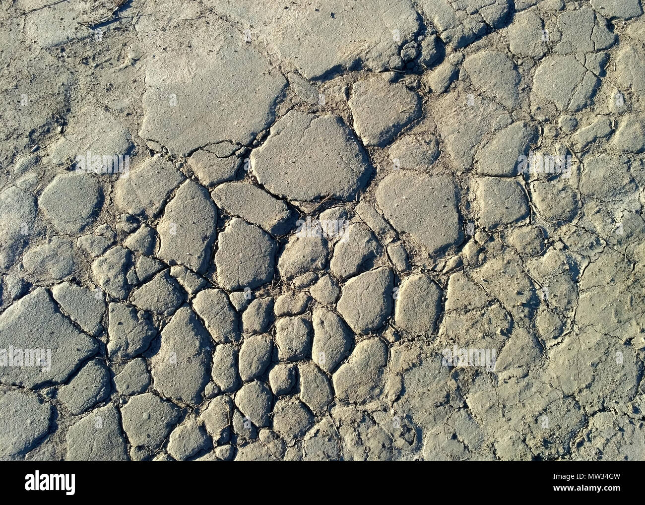 Smashed asphalt on old broken road Closeup Stock Photo - Alamy