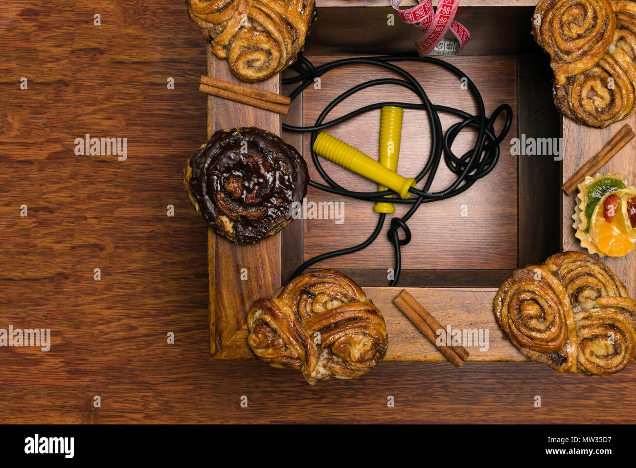 sweet cinamon and chocolate buns with tape measure, jump rope ...