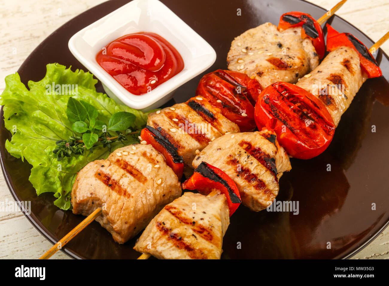 Grilled turkey skewer with tomato and pepper Stock Photo - Alamy