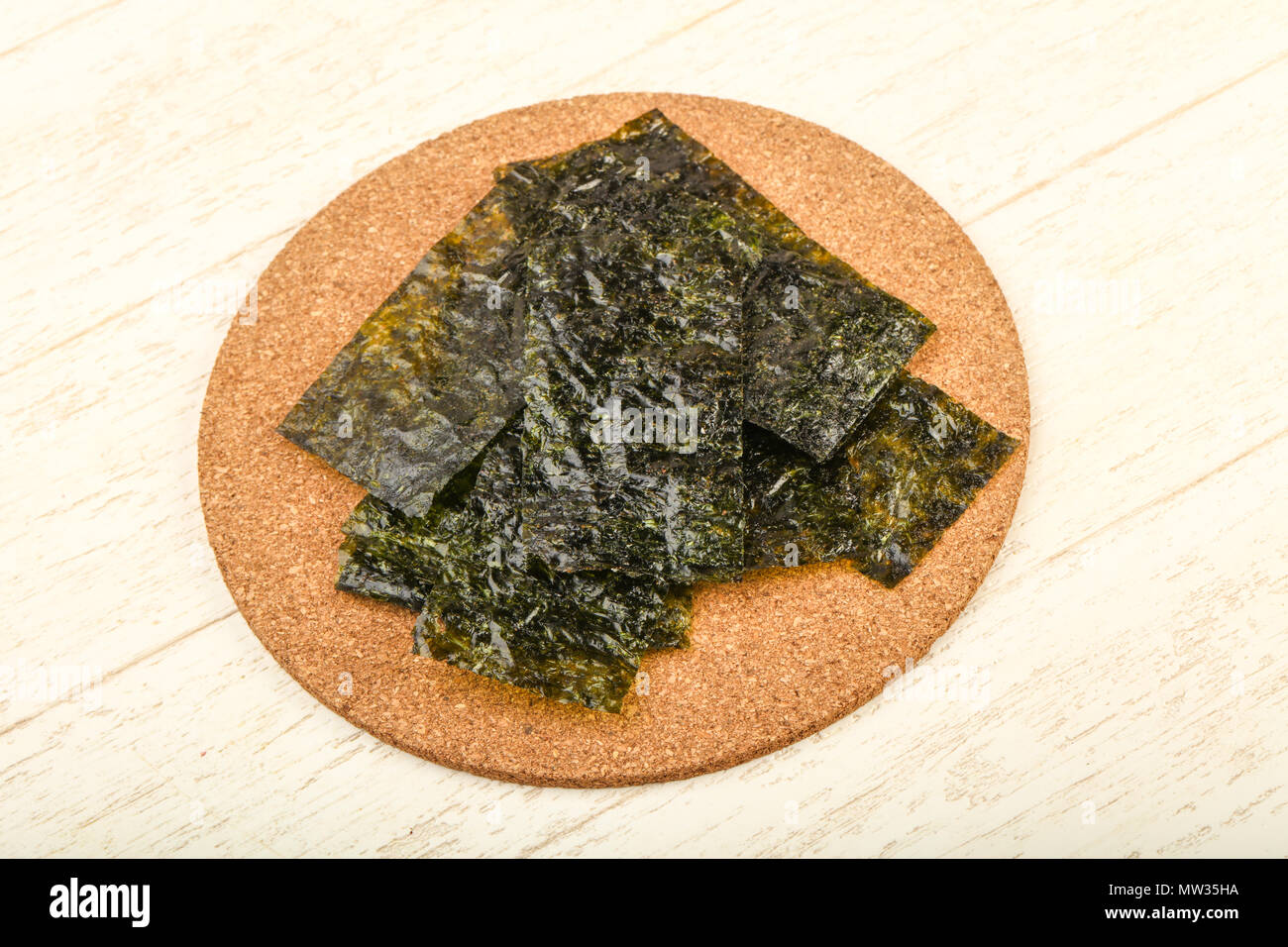 Crispy Nori sheets chips over wooden background Stock Photo - Alamy