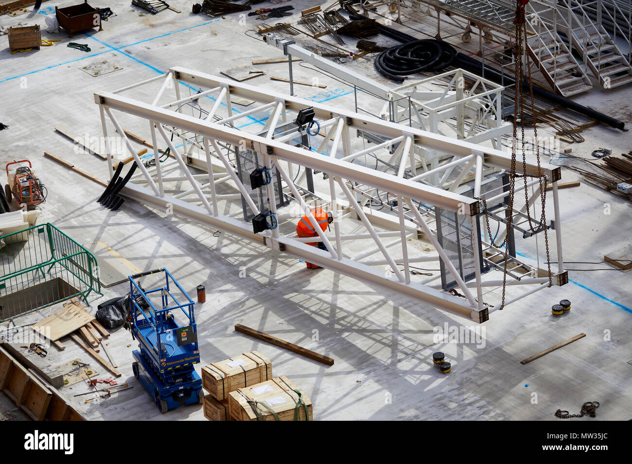 Construction workers building the tower crane at Sir Henry Royce ...