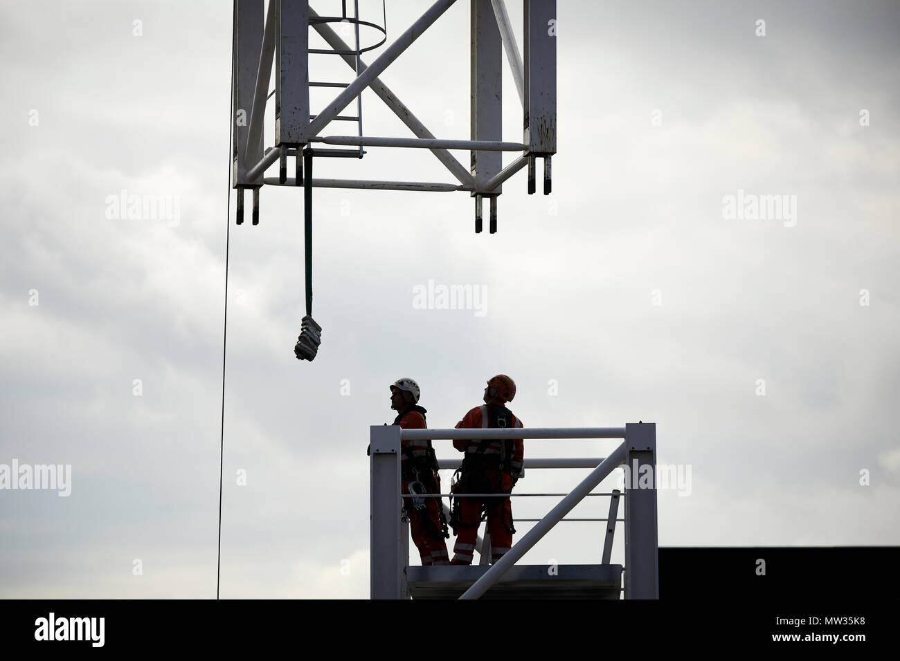 Construction workers building the tower crane at Sir Henry Royce ...
