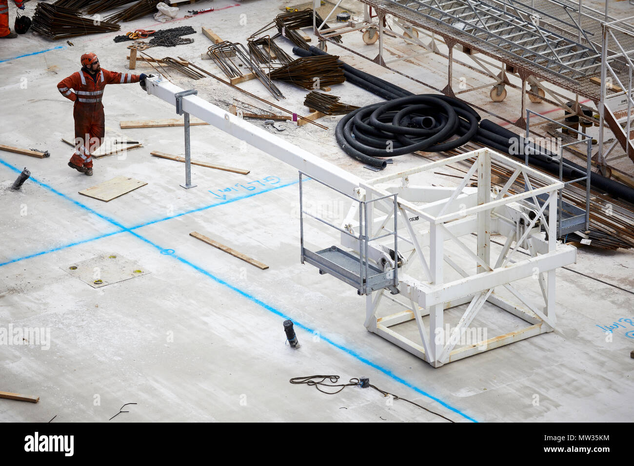 Construction workers building the tower crane at Sir Henry Royce ...