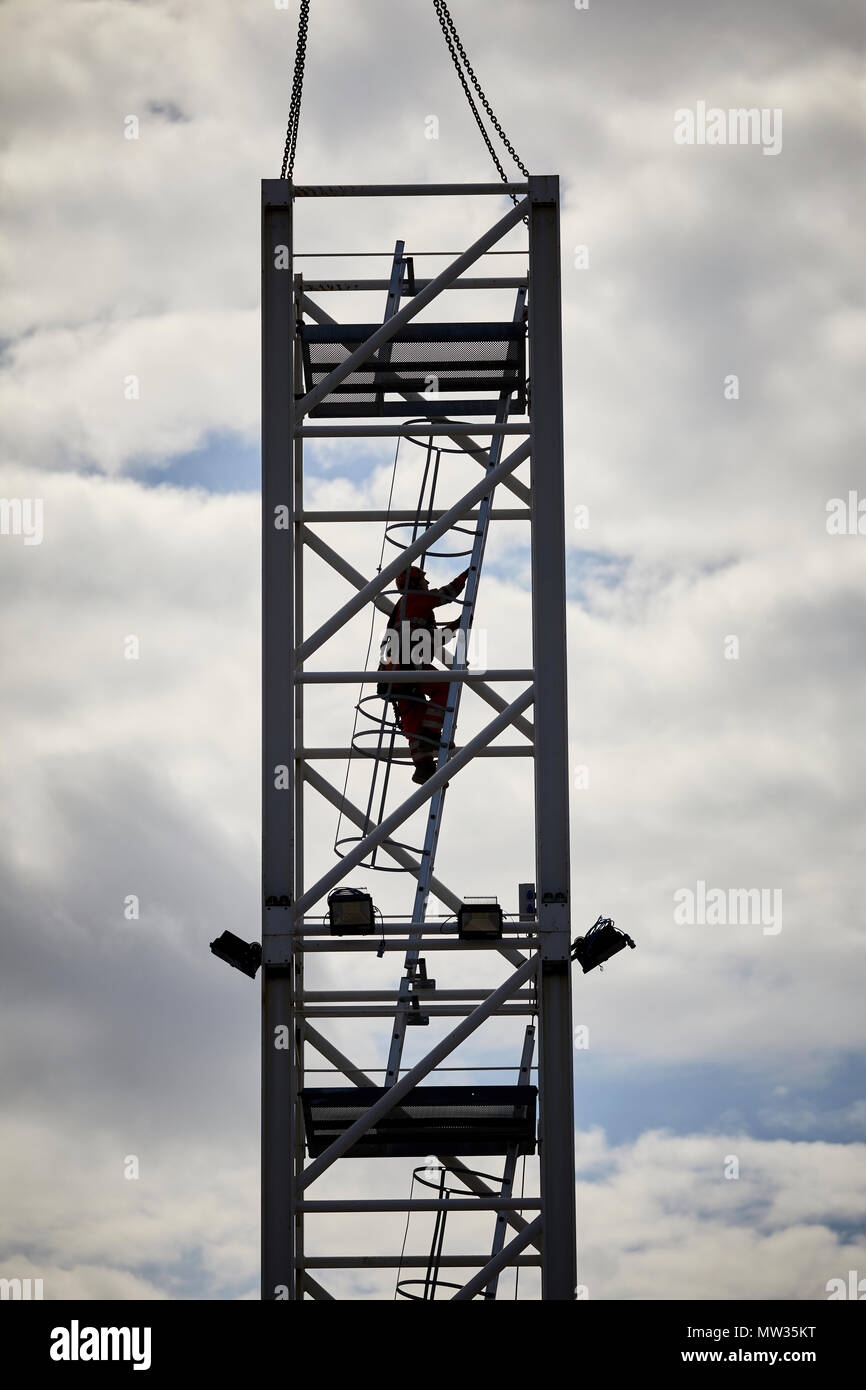 Construction workers building the tower crane at Sir Henry Royce ...
