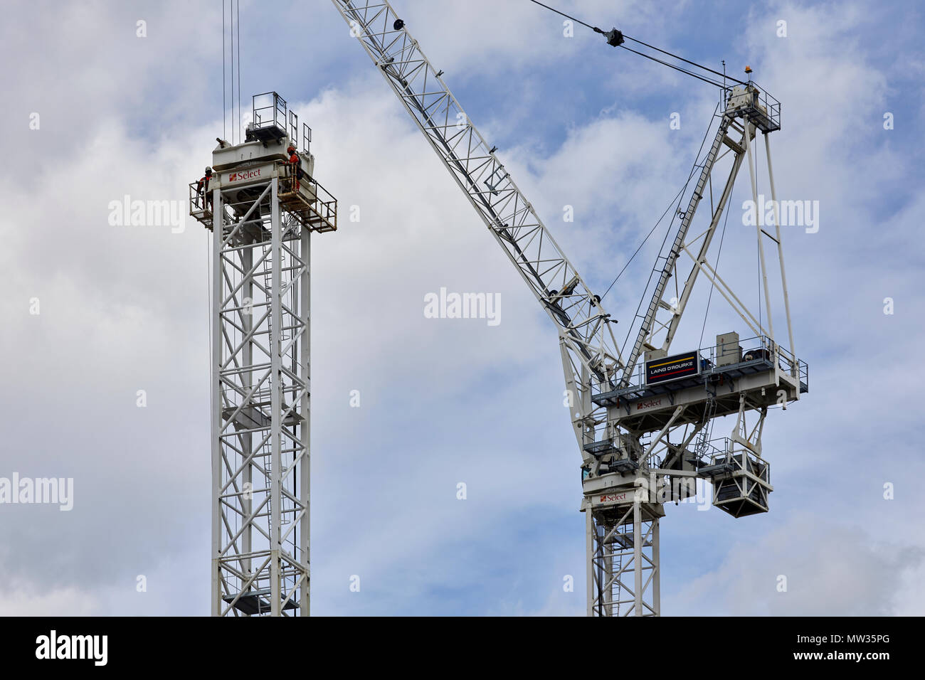 Construction workers building the tower crane at Sir Henry Royce ...