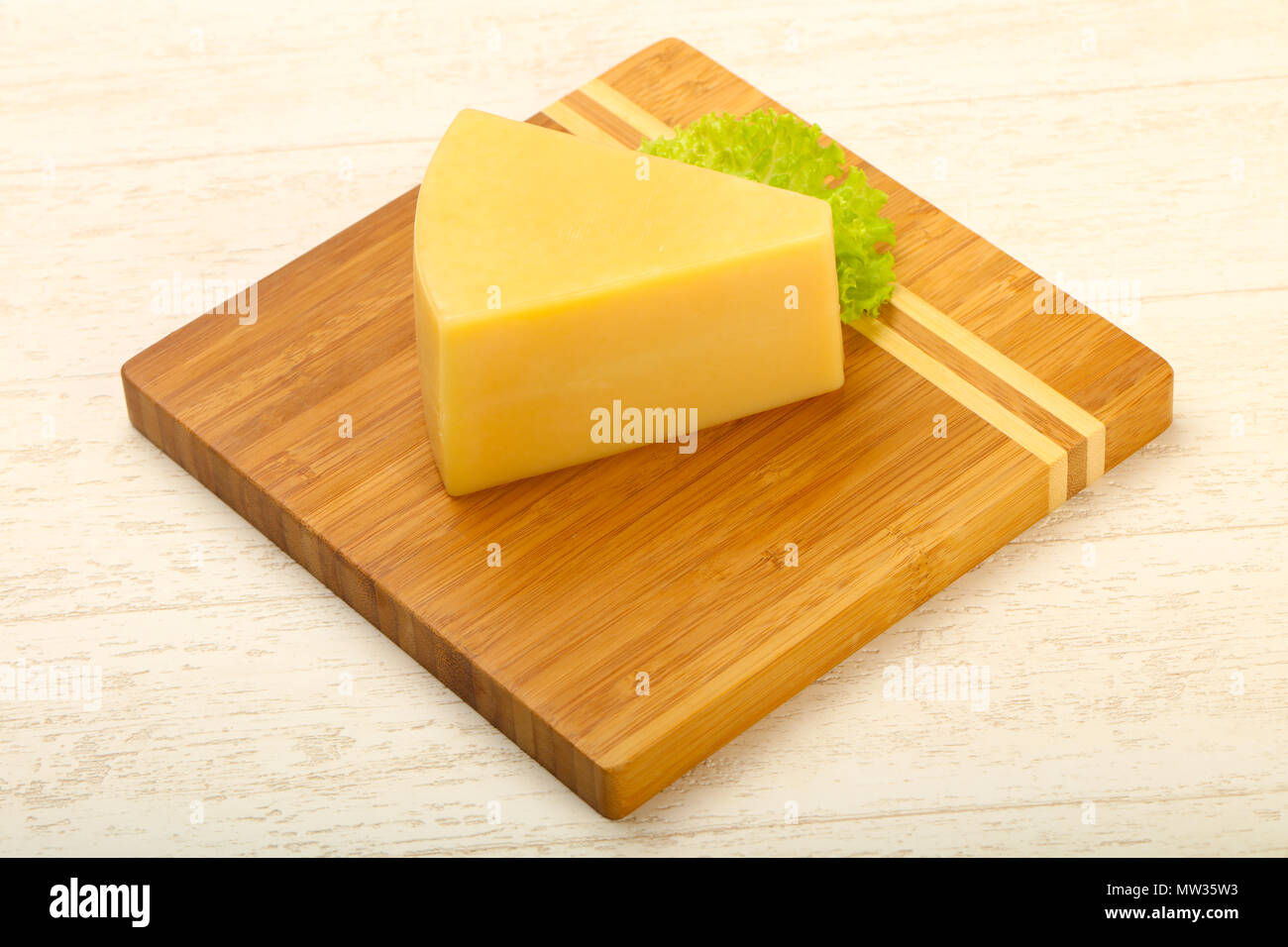 Parmesan cheese triangle Stock Photo - Alamy