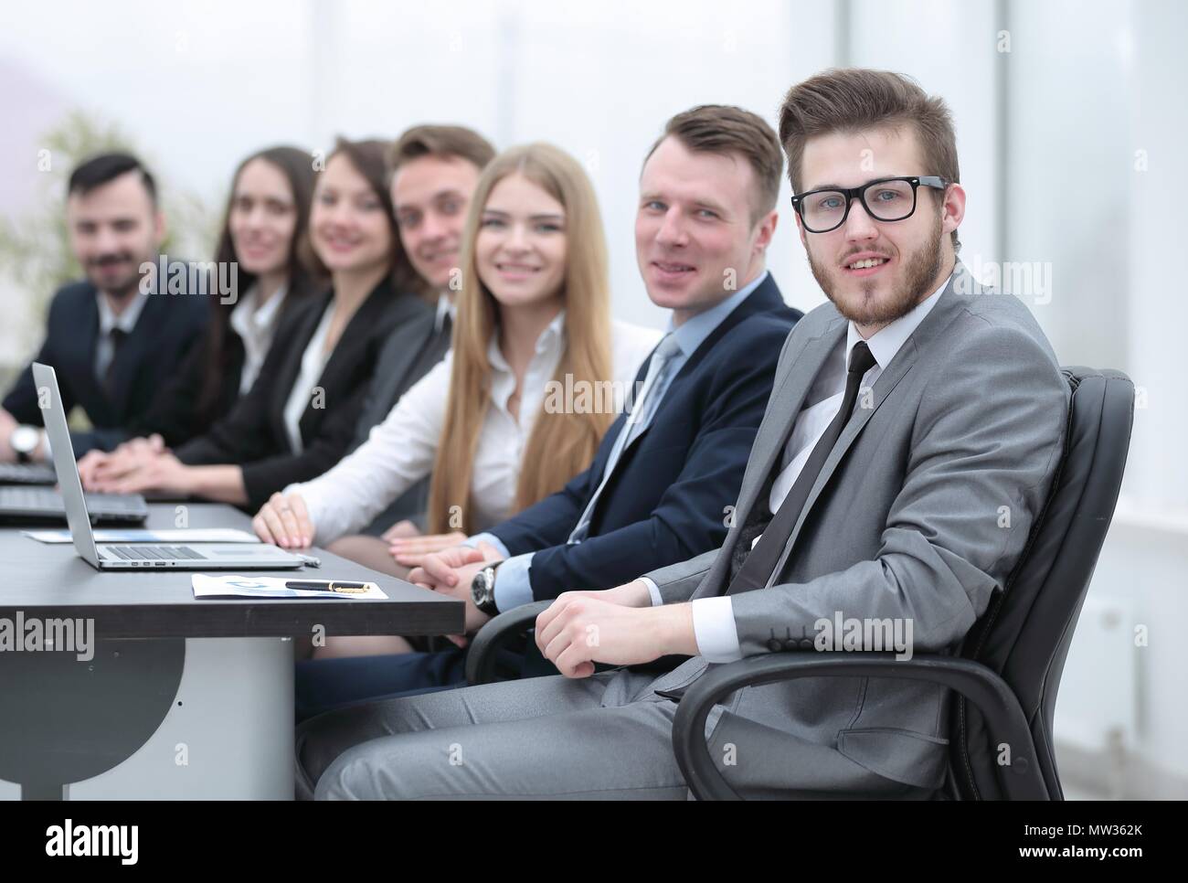 business team sitting at Desk in the conference room Stock Photo - Alamy
