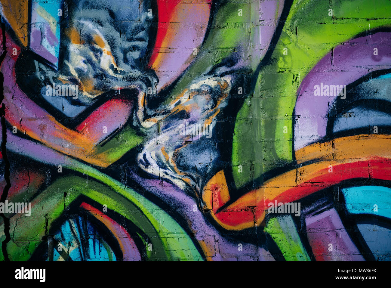 close up of colorful graffiti on wall in city, street art Stock Photo ...
