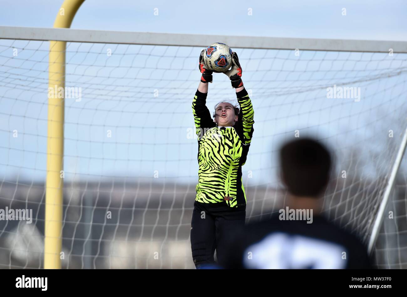 Keeper making a leaping save of a shot that was destined for the top of ...