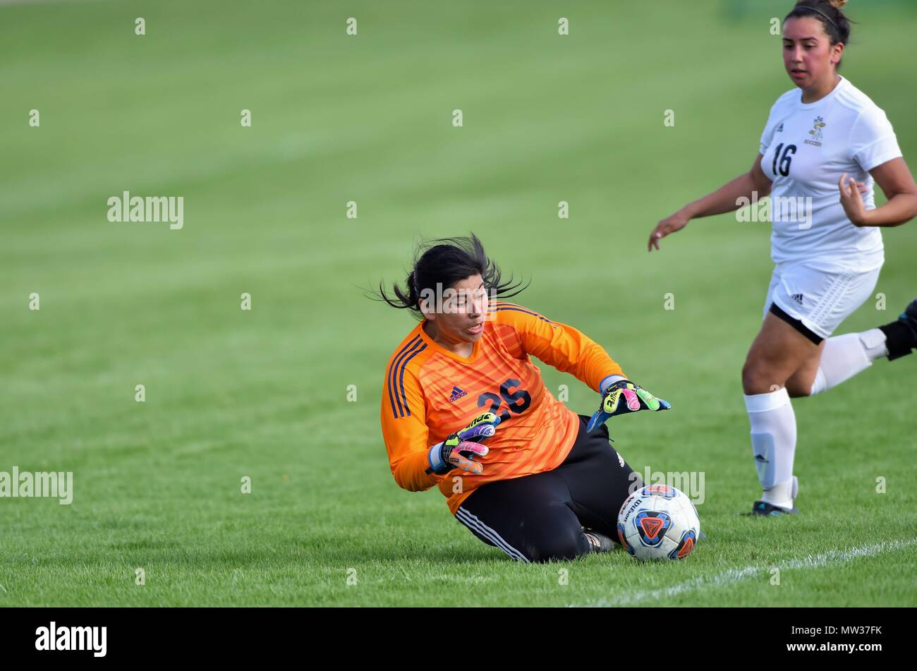 Female football goal keeper save ball hi-res stock photography and ...