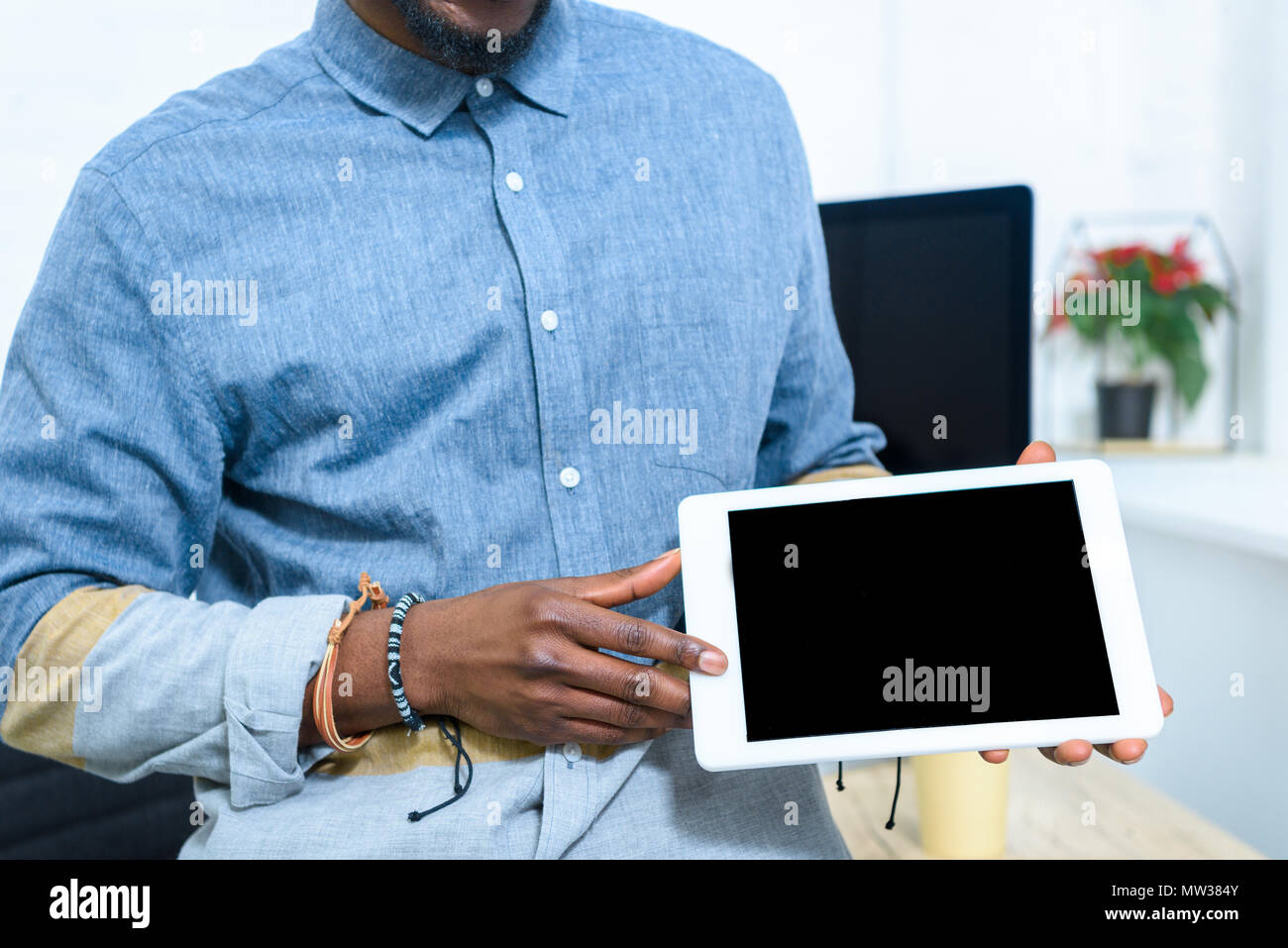 African guy showing digital hi-res stock photography and images - Alamy