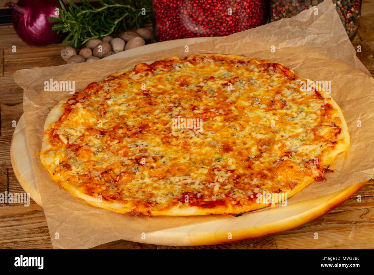 Delicious and big "4 cheese" pizza Stock Photo - Alamy