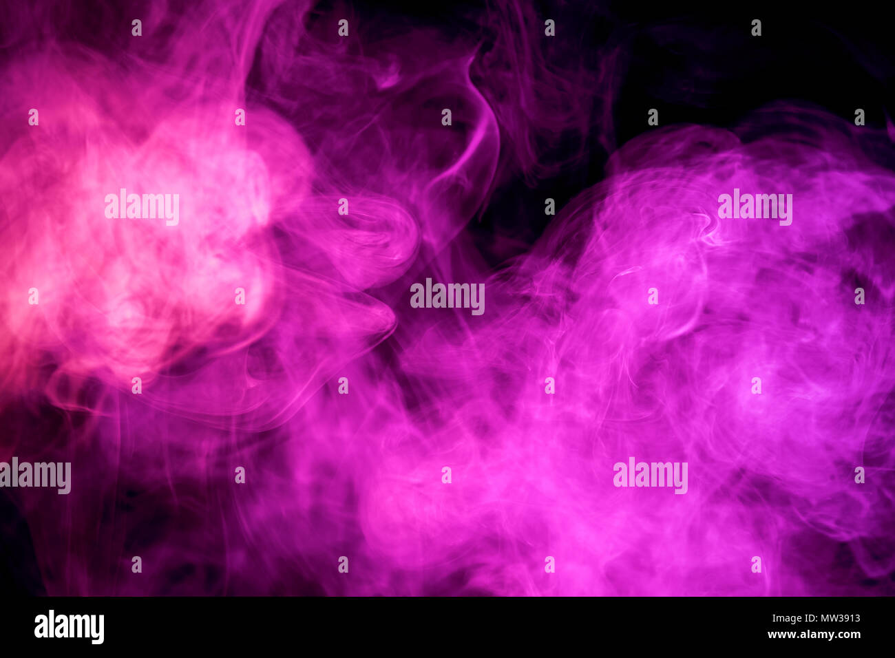 Thick colorful pink smoke on a black isolated background. Background ...