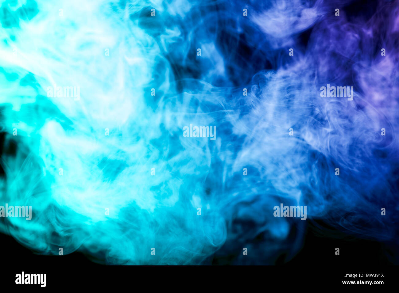 Thick colorful blue smoke on a black isolated background. Background ...
