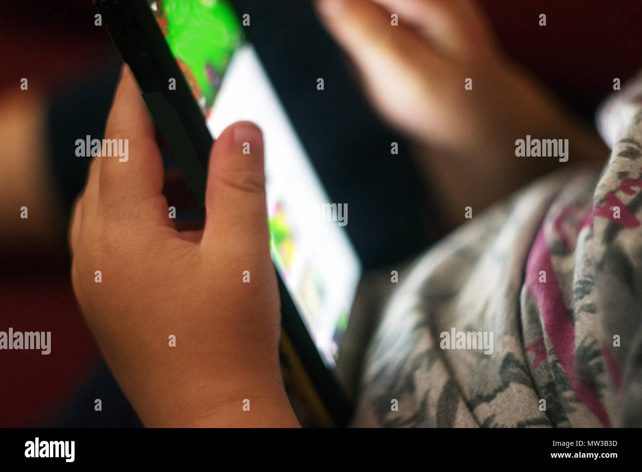 Little boy child kid playing games on smartphone mobile phone Stock ...