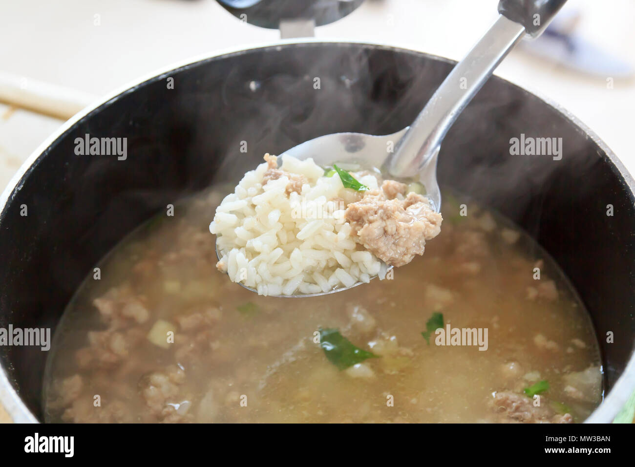 Hot porridge rice pig in pot Stock Photo - Alamy