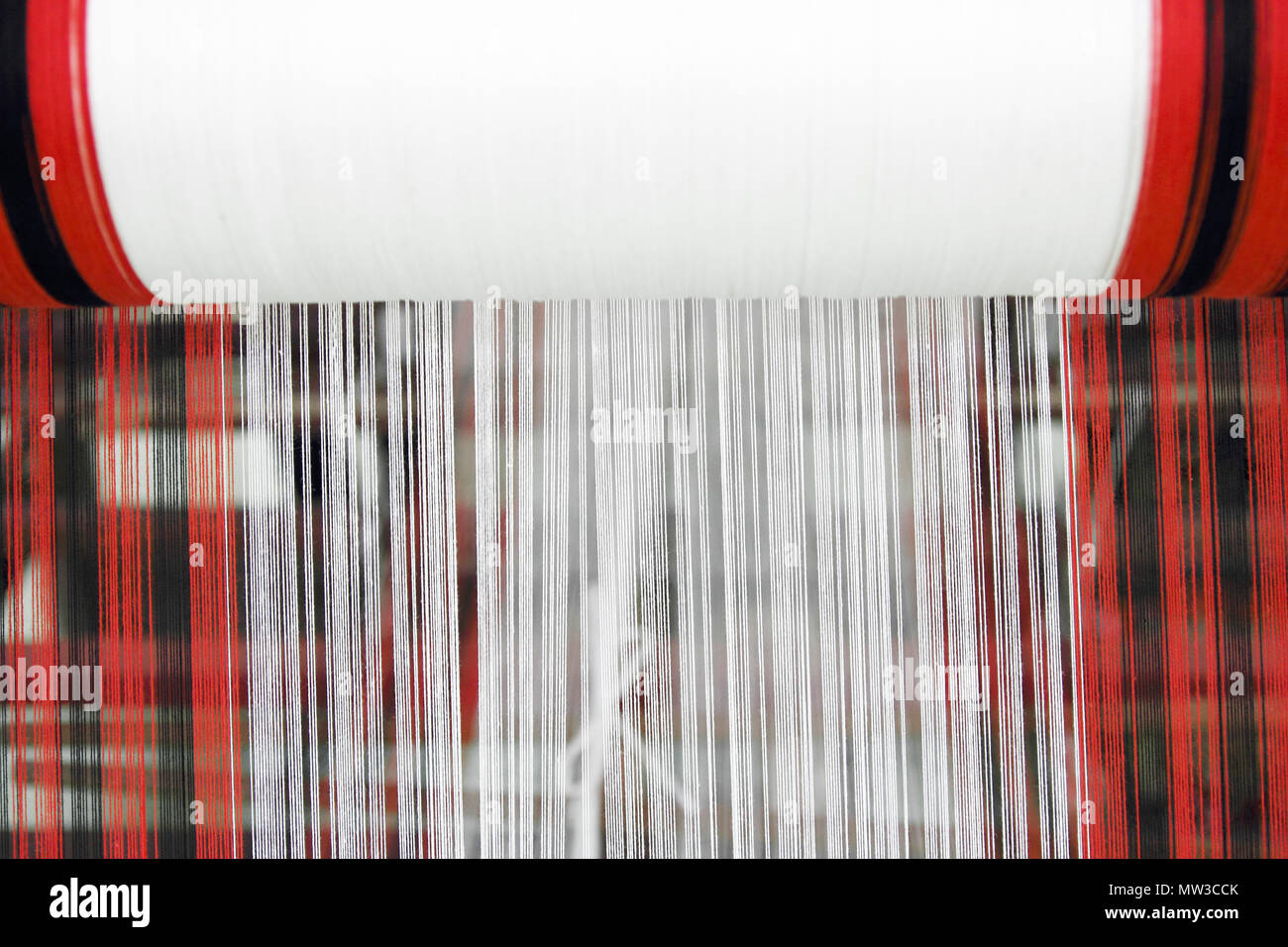 Colorful yarn pattern is set up on the loom bench and ready to weave ...