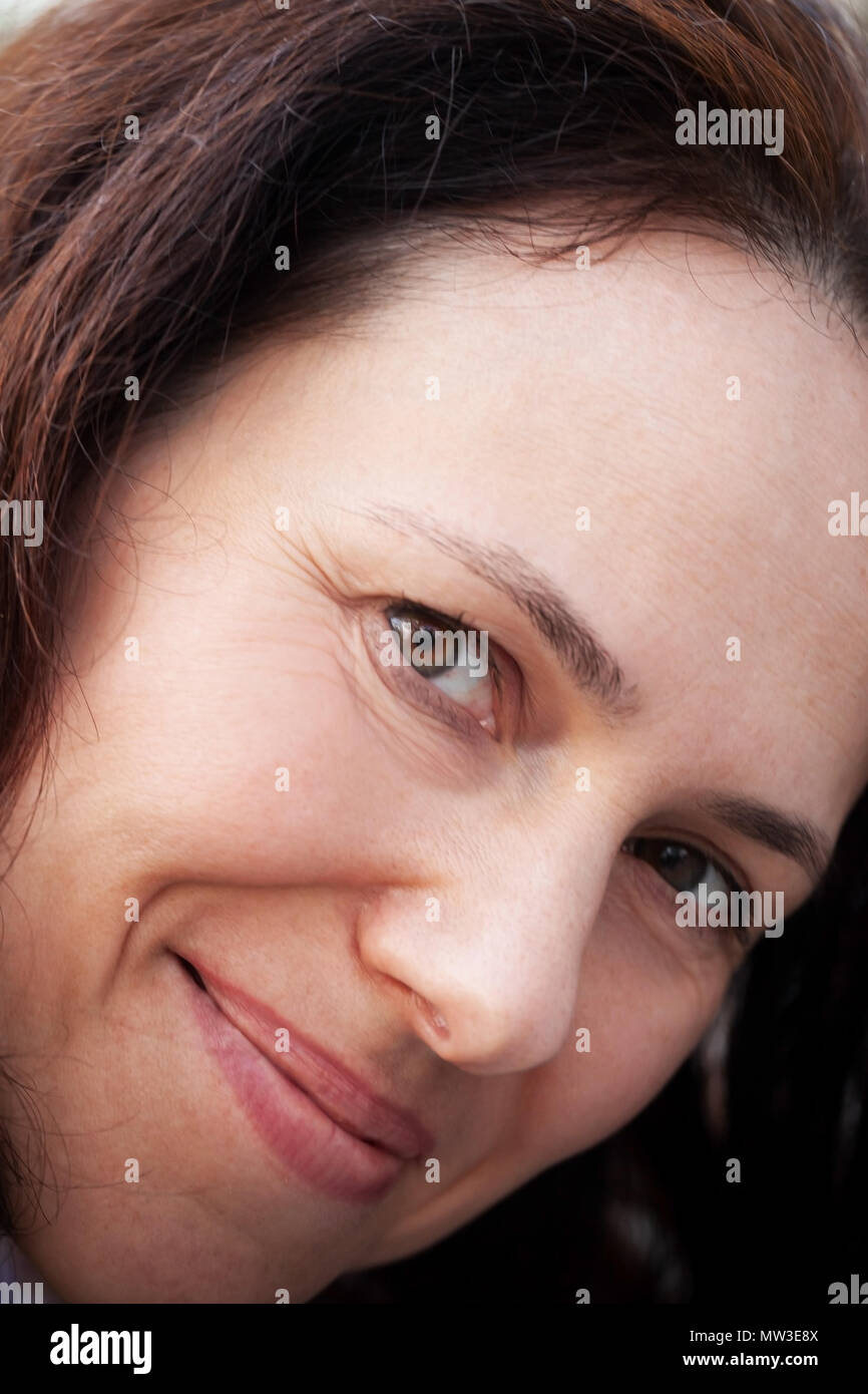 Positive smiling young adult European woman, close-up face portrait ...