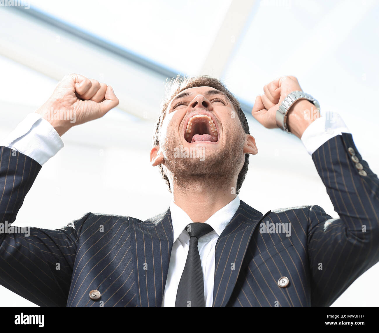 portrait, triumphant businessman ,isolated on white background Stock ...